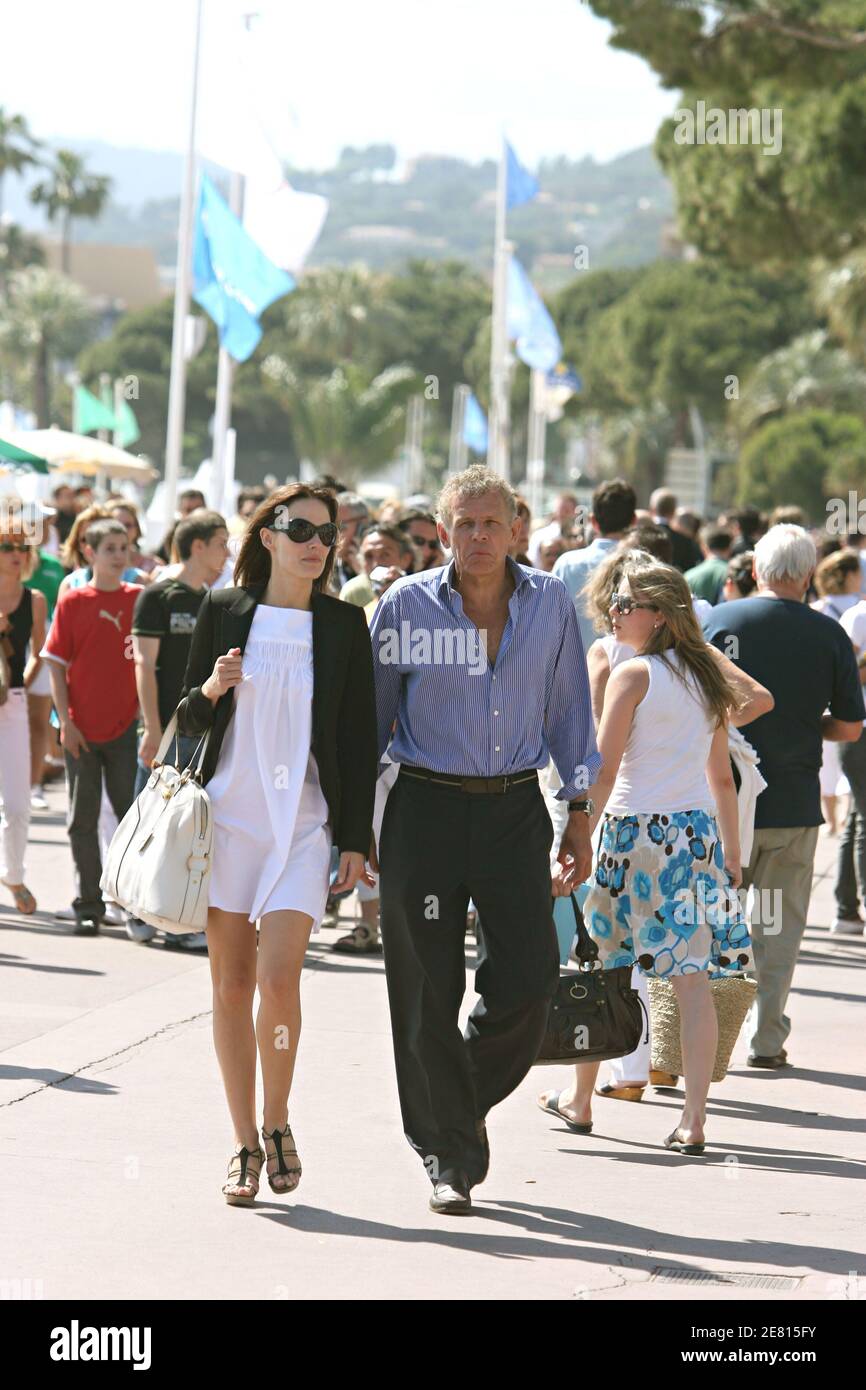 TV anchor Patrick Poivre d'Arvor walks with his girlfriend Agathe Borne ...