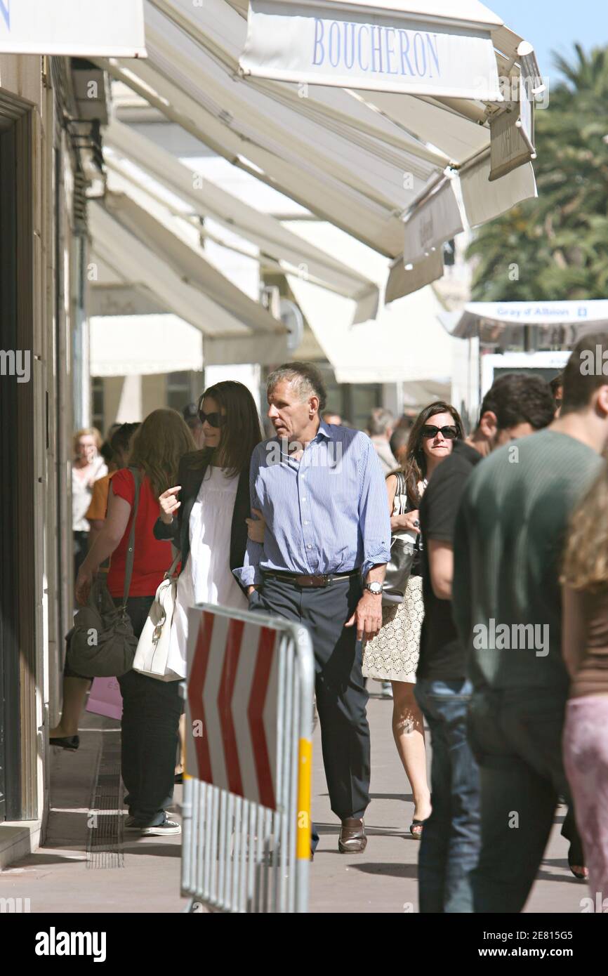 TV anchor Patrick Poivre d'Arvor walks with his girlfriend Agathe Borne ...