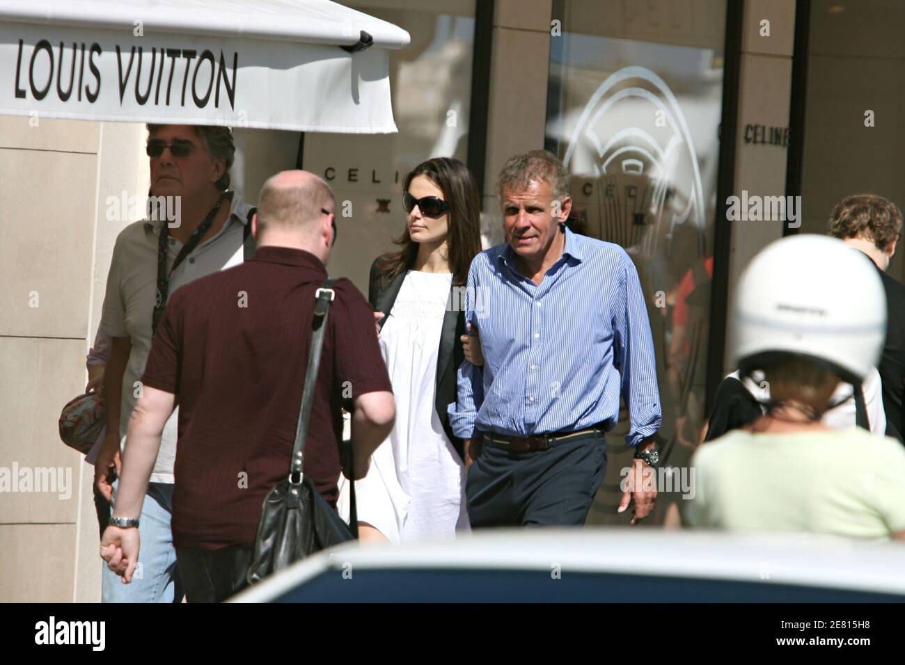 TV anchor Patrick Poivre d'Arvor walks with his girlfriend Agathe Borne ...