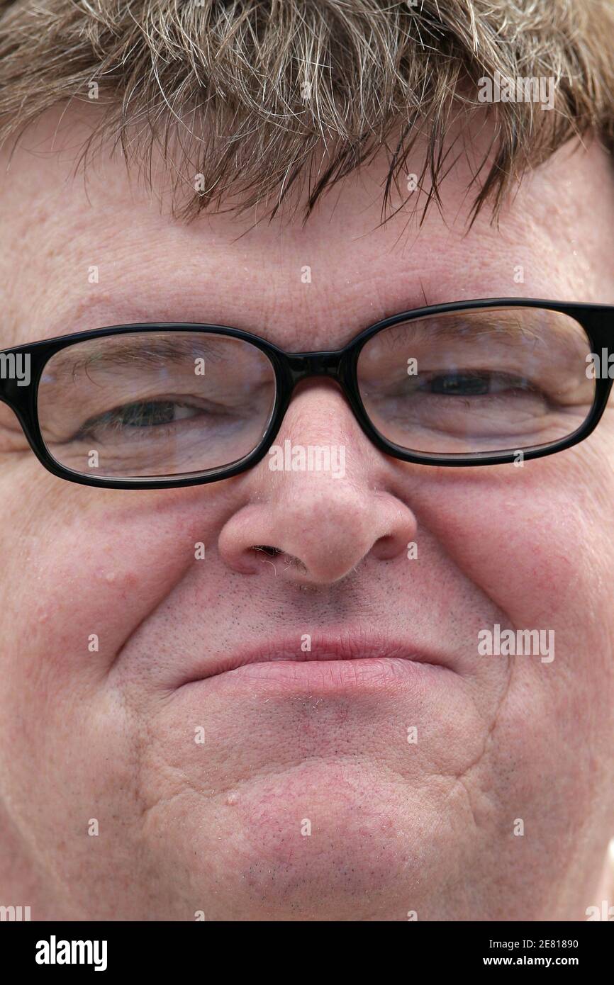 Michael Moore poses for the media during a photocall for 'SICKO' during ...