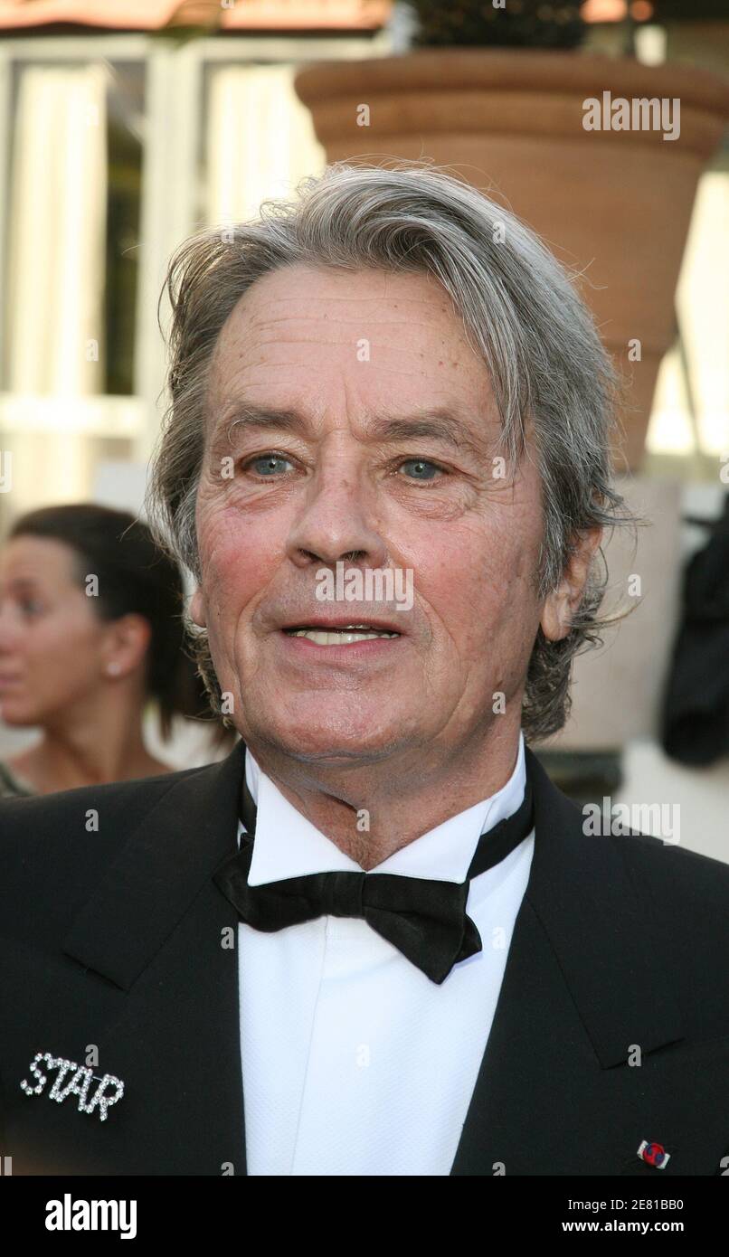 French actor Alain Delon leaves the Majestic hotel walking among the ...