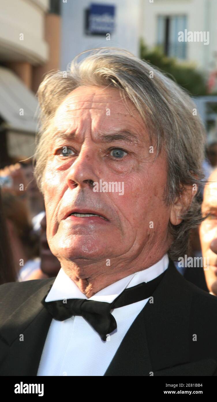 French actor Alain Delon leaves the Majestic hotel walking among the ...