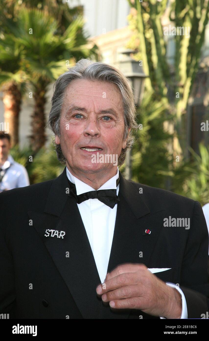 French actor Alain Delon leaves the Majestic hotel walking among the ...
