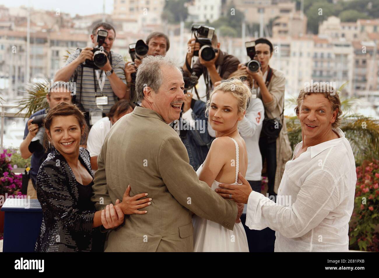 Director Denys Arcand (2nd L) poses with actors (from L) Emma de Caunes ...