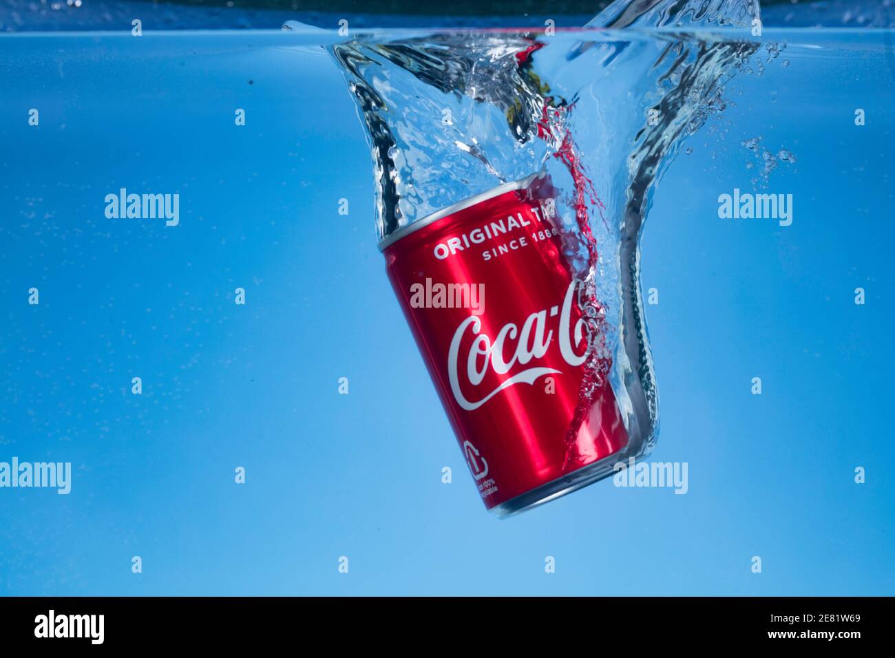 Freeze motion photo of a mini coca cola can dropped into water Stock ...