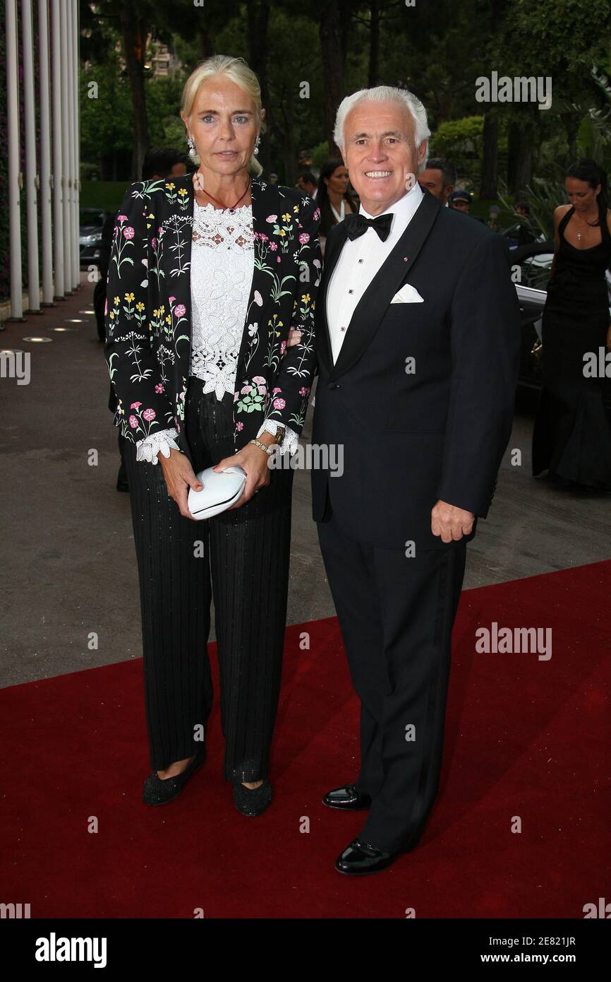 Yves Piaget and his wife pose for picture as they arrive at the 'Tenue ...
