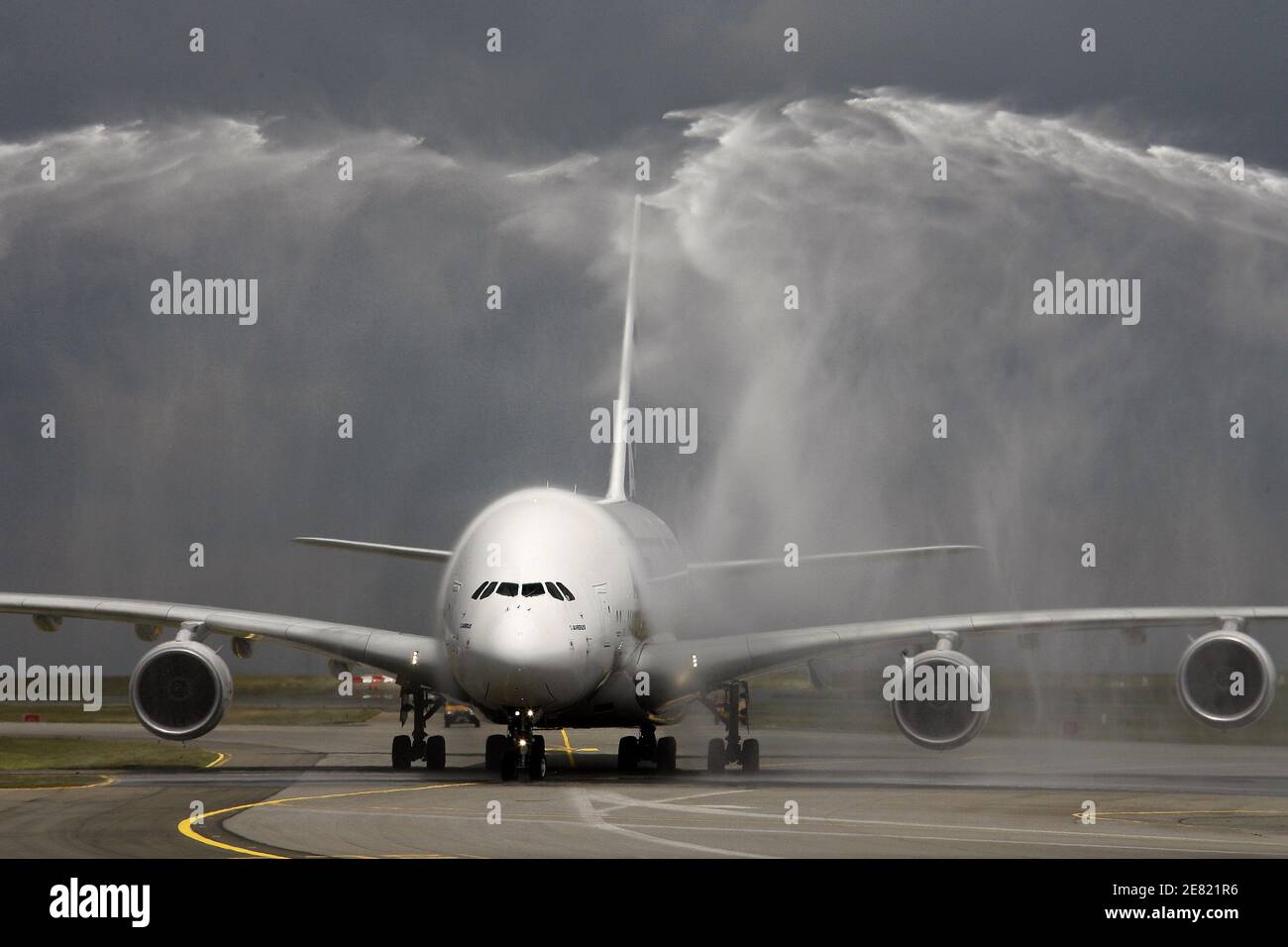 Fire-trucks send water on the Airbus A380, the new double-decker 555 ...