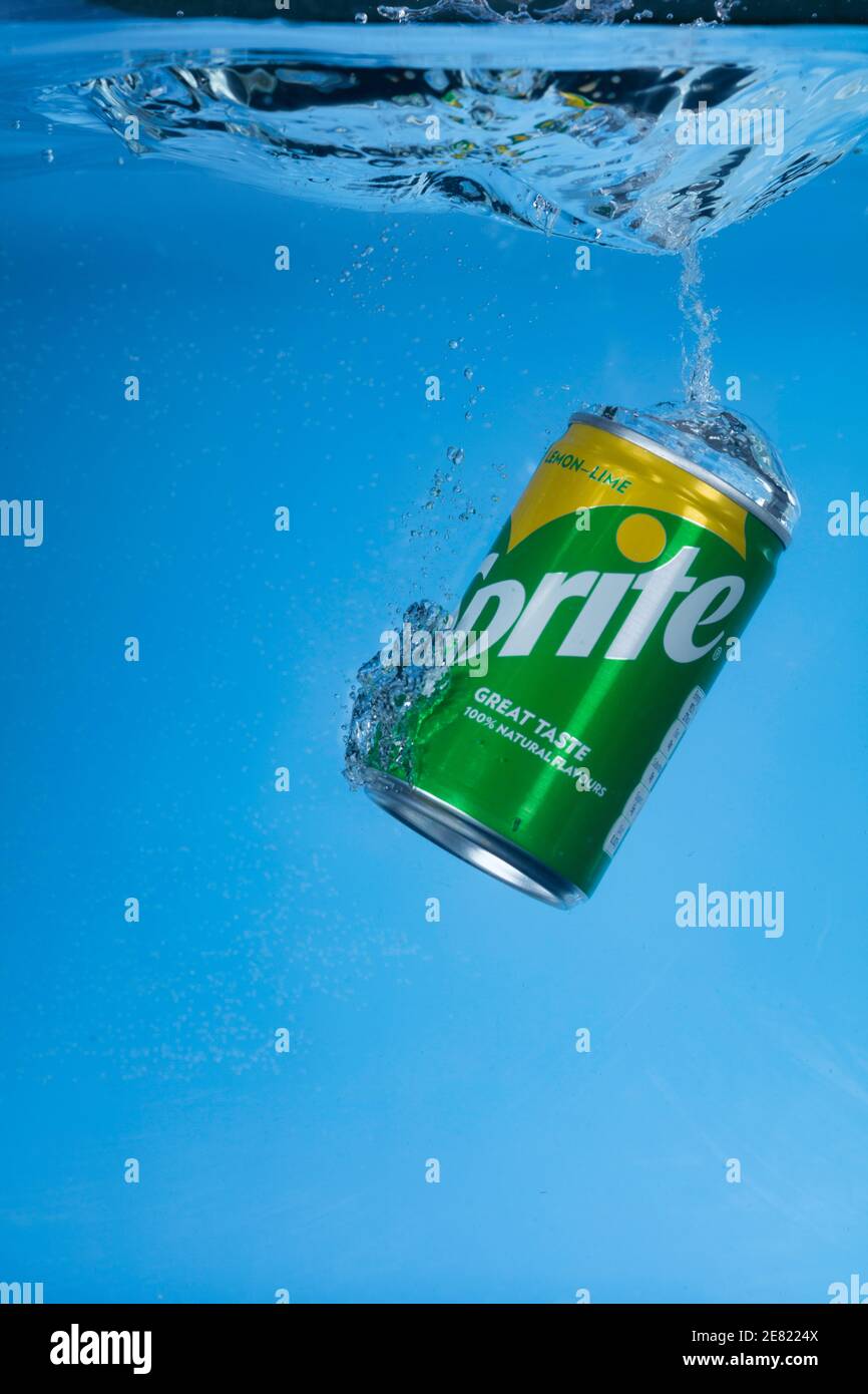 Freeze motion photo of a Sprite can dropped into water Stock Photo - Alamy