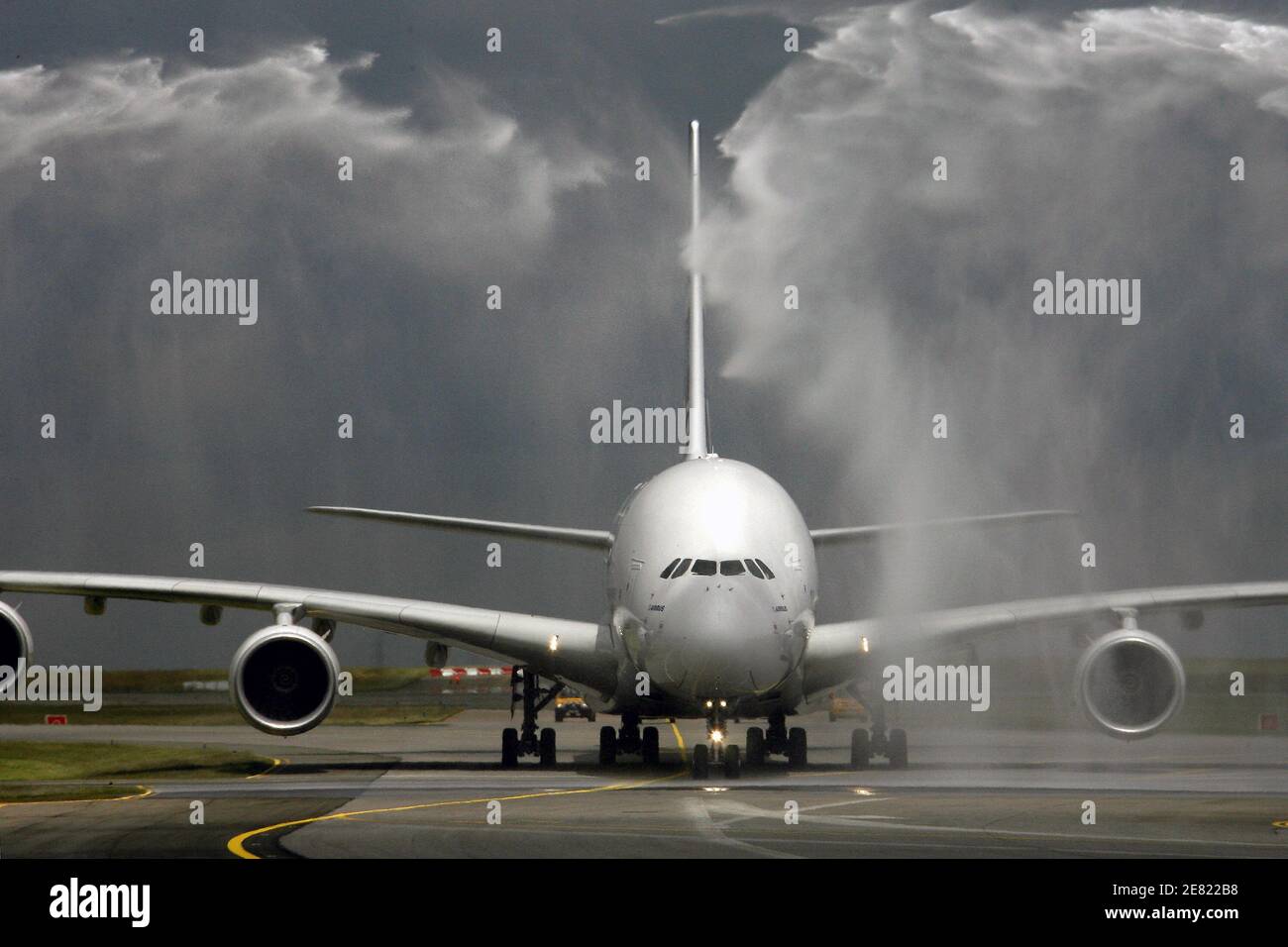 Fire-trucks send water on the Airbus A380, the new double-decker 555 ...