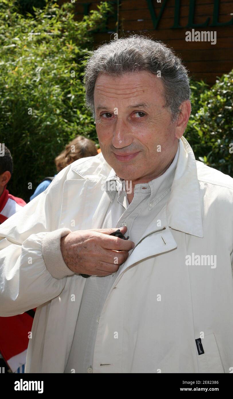 French TV presenter Michel Drucker poses in the 'Village', the VIP area ...