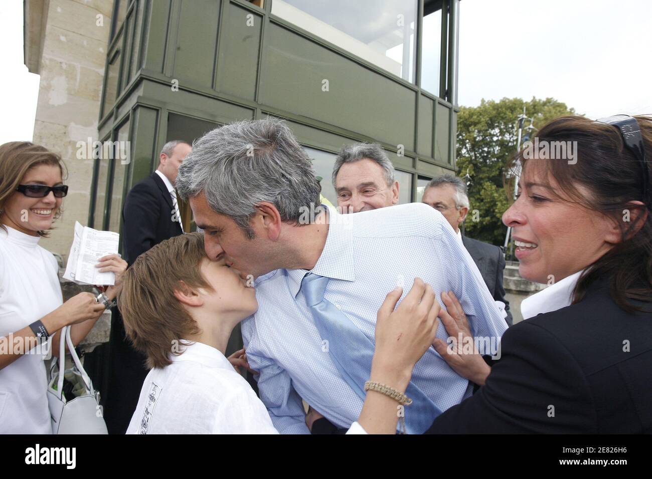 French Defense minister Herve Morin with his wife and his son attends ...