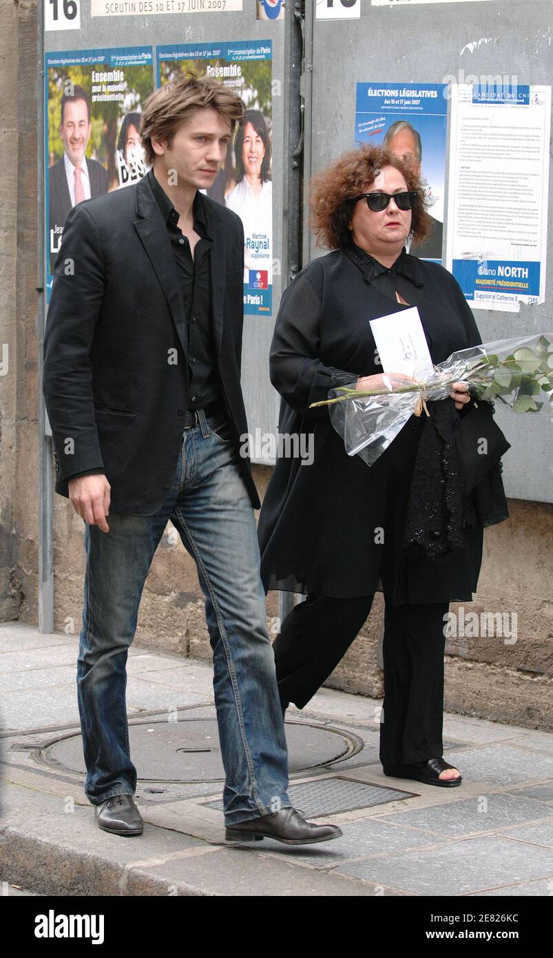 French actor Stanislas Merhar and a friend arrive at the funerals mass ...