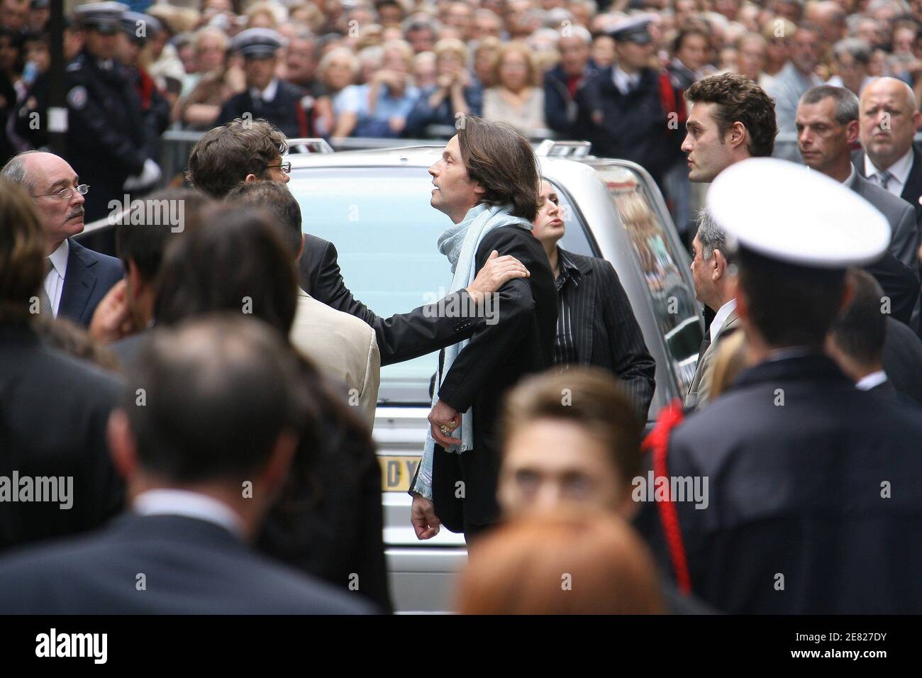 Bruno Finck arrives at the funeral mass for his partner, French actor ...