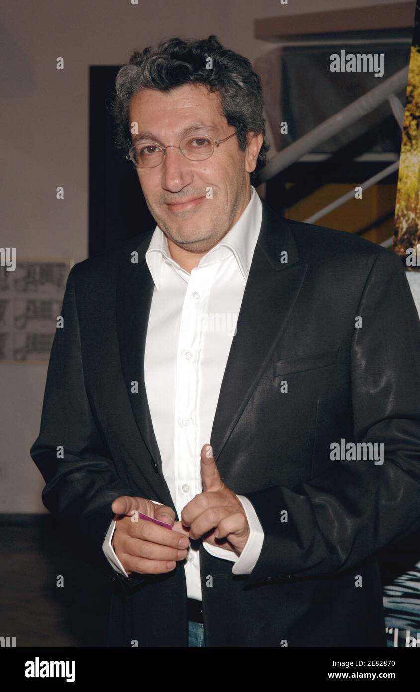 Comedian Alain Chabat poses for pictures as he arrives to the premiere ...