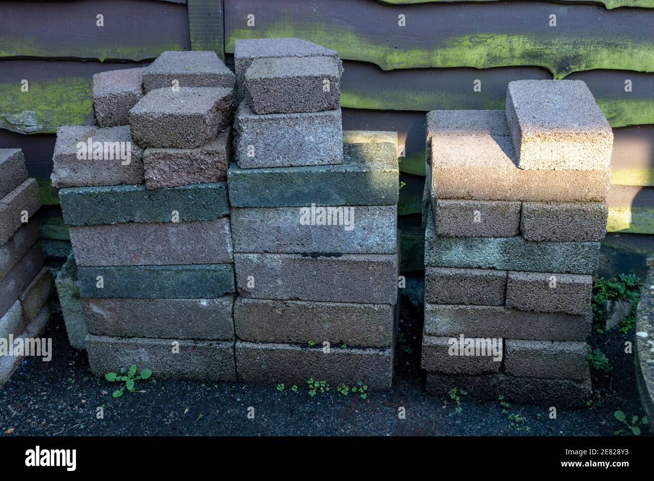 a close up view of old concrete bricks pilled on top of each other ...