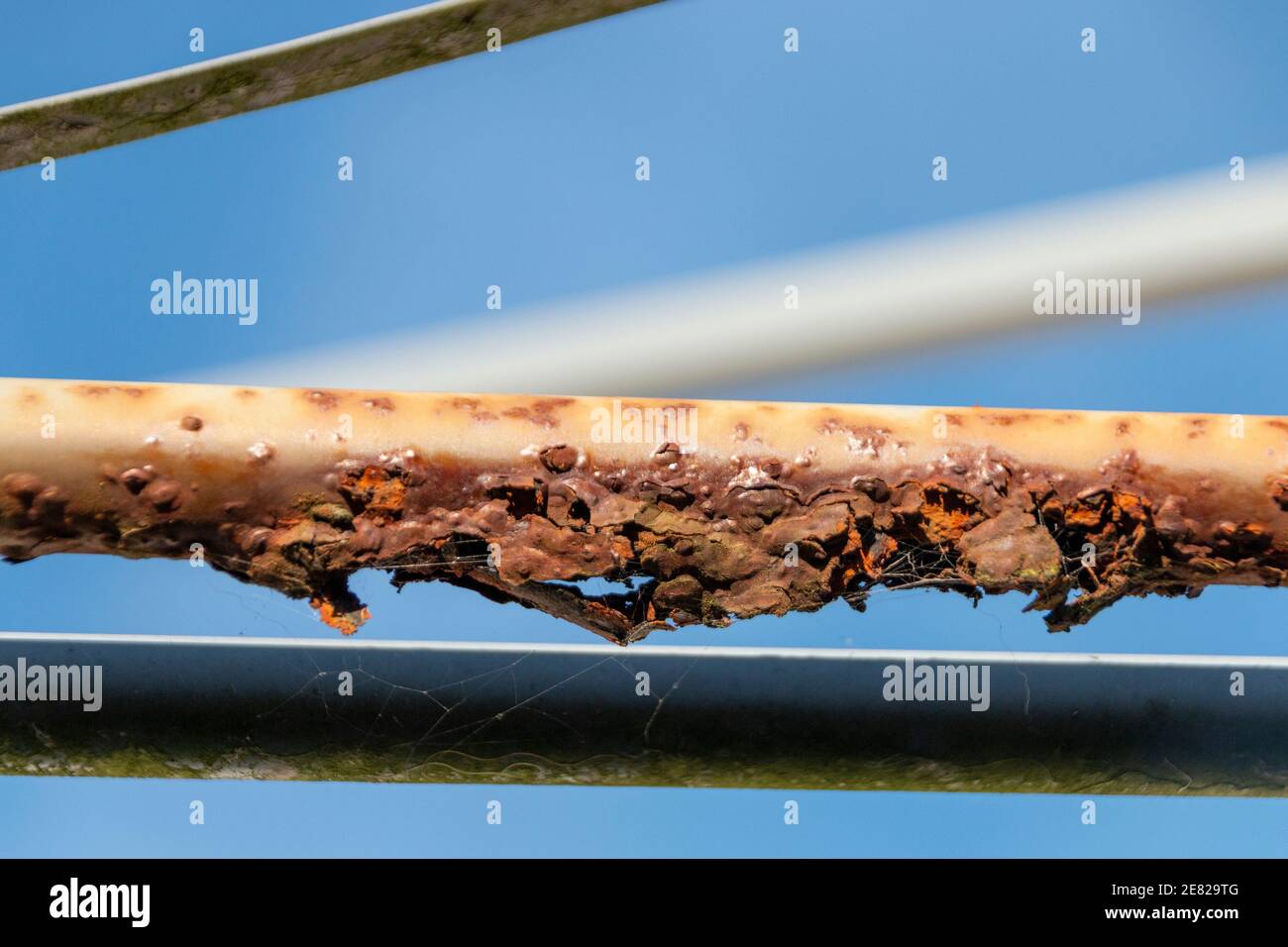 a close up view of a portion of rusted metal pole Stock Photo - Alamy