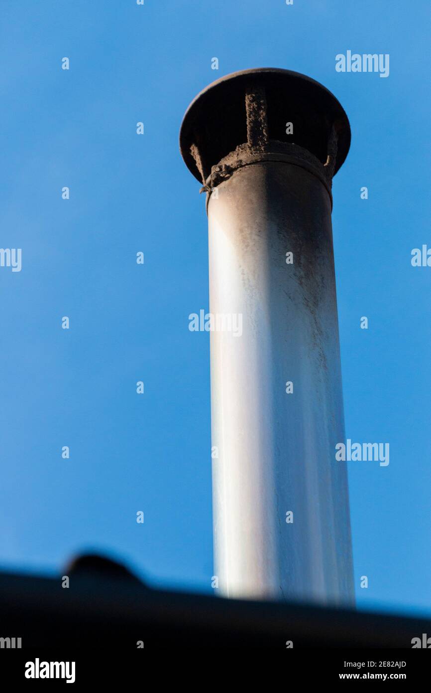 a close up view of a metal chimney where all the black residue has ...