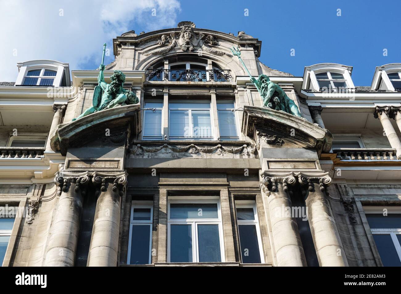 Neptune sculptures on a building facade in Antwerp, Belgium Stock Photo ...