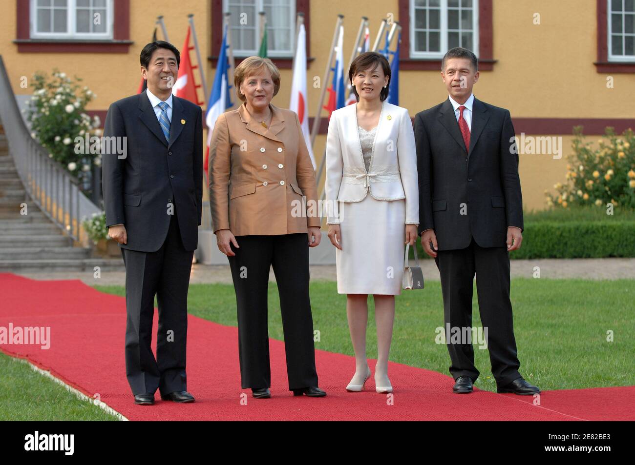 German Chancellor Angela Merkel and her husband Joachim Sauer welcome ...