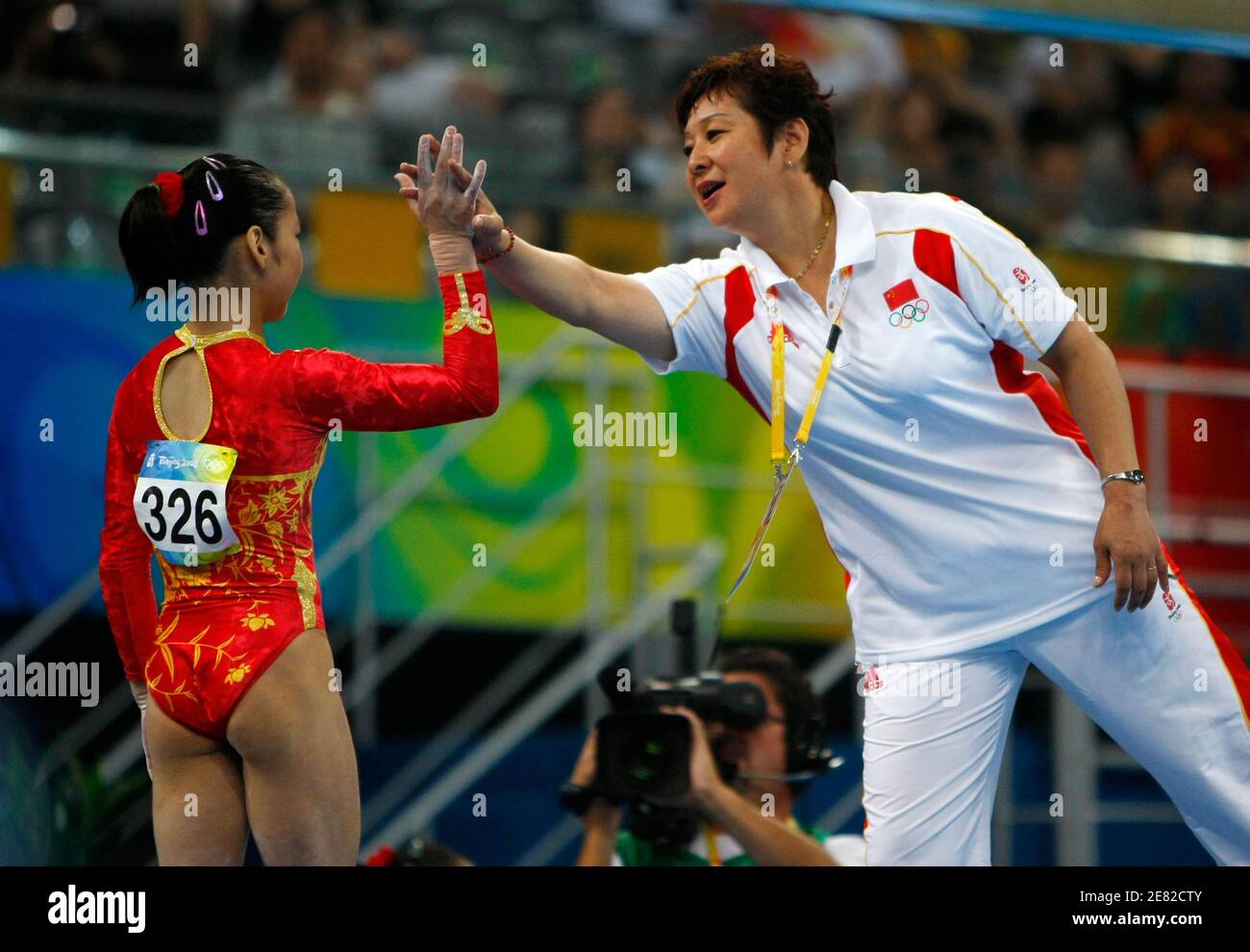 Women's Gymnastics Coach High Resolution Stock Photography and Images ...