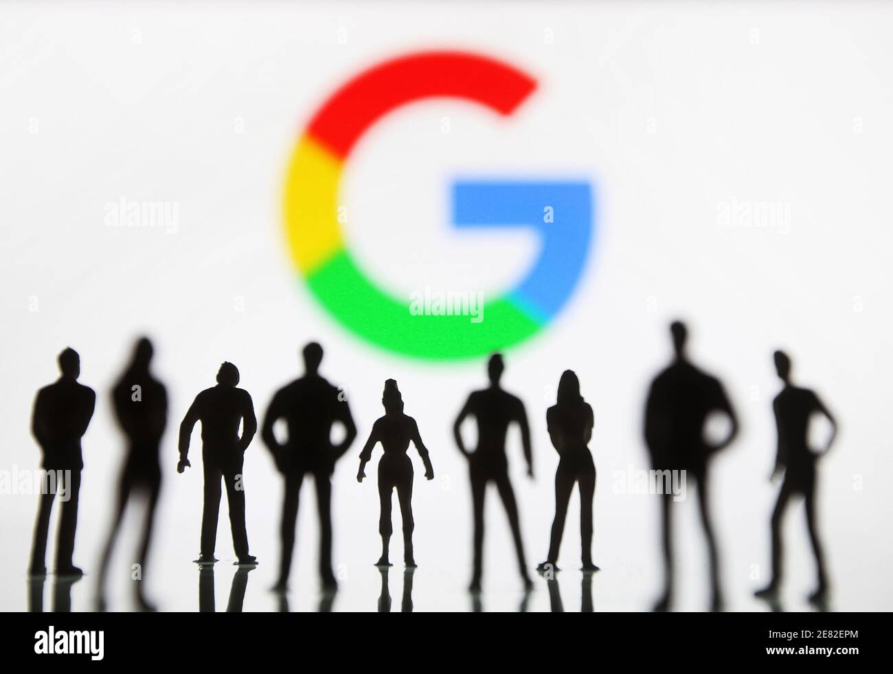 In this photo illustration a Google logo seen displayed in front of ...