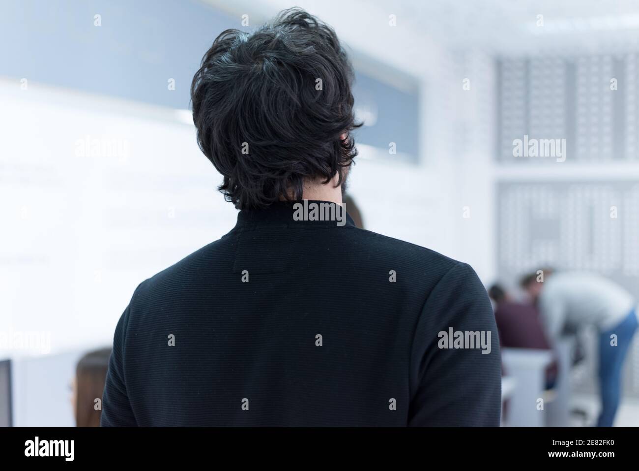 Teacher assisting college student in a computer lab. Technology and ...