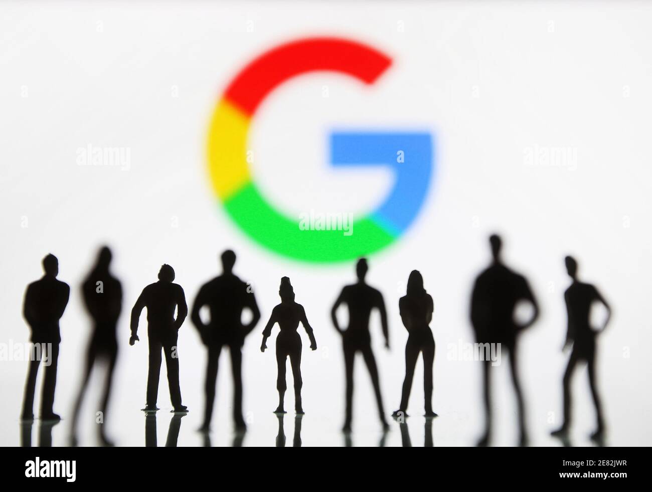 In this photo illustration a Google logo seen displayed in front of ...