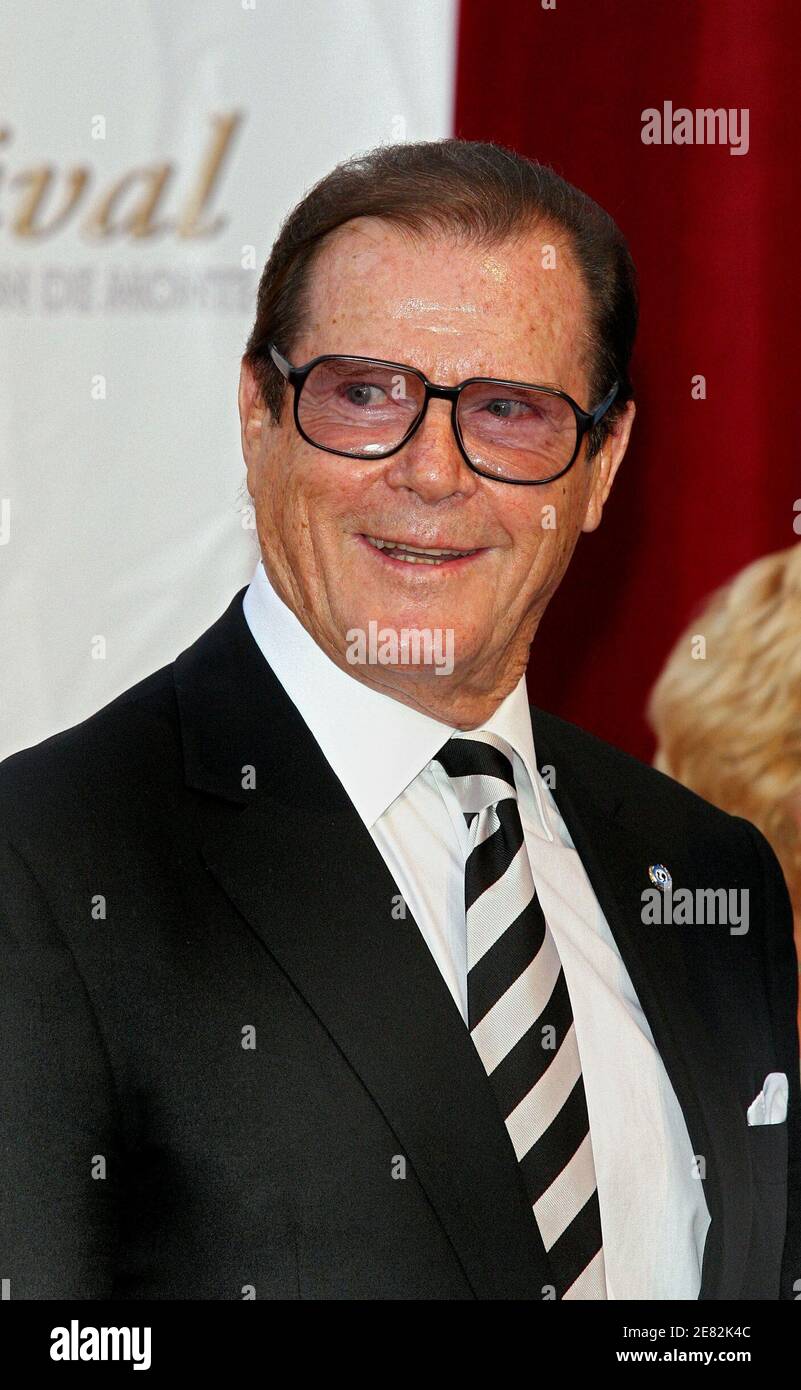 British actor Sir Roger Moore poses for pictures during the opening ...