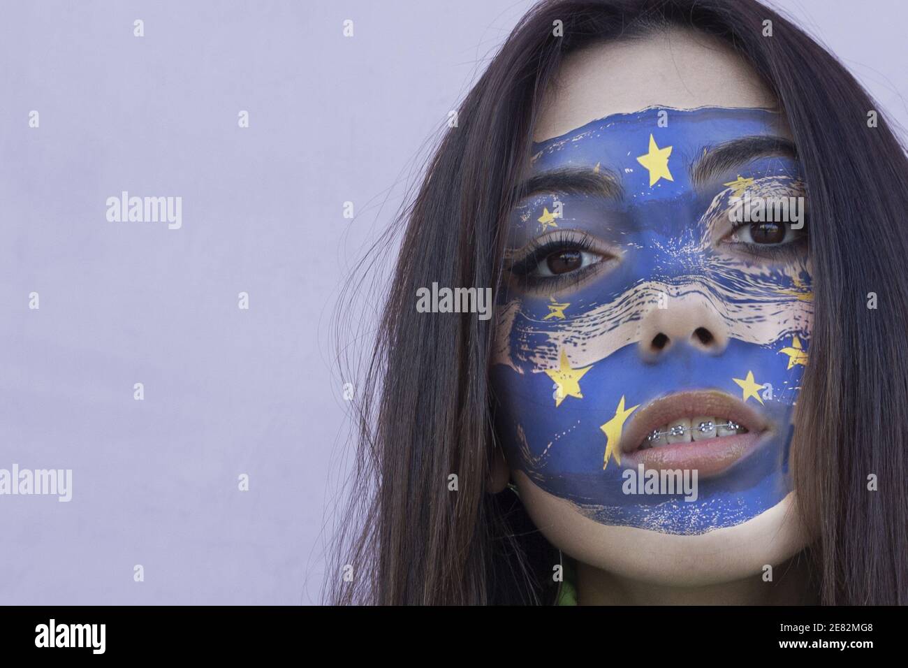 Flag of Europe painted on a face of a young female Stock Photo - Alamy