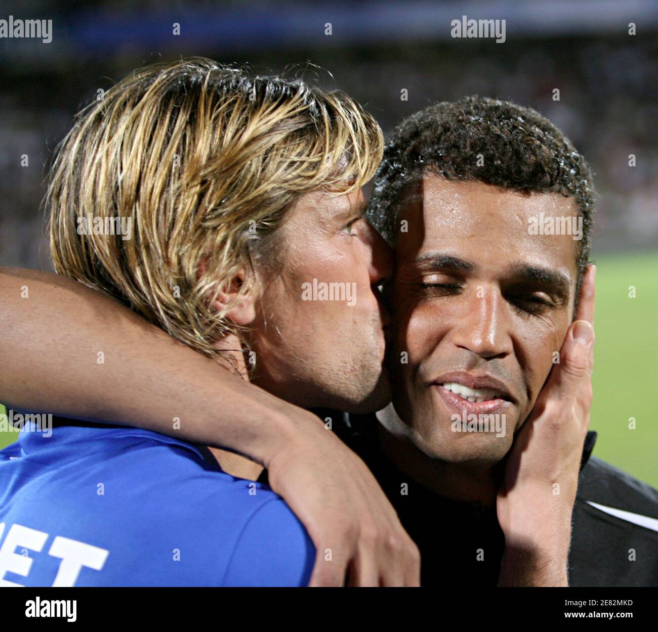 Lyon's goalkeeper Gregory Coupet kisses Sonny Anderson during his ...