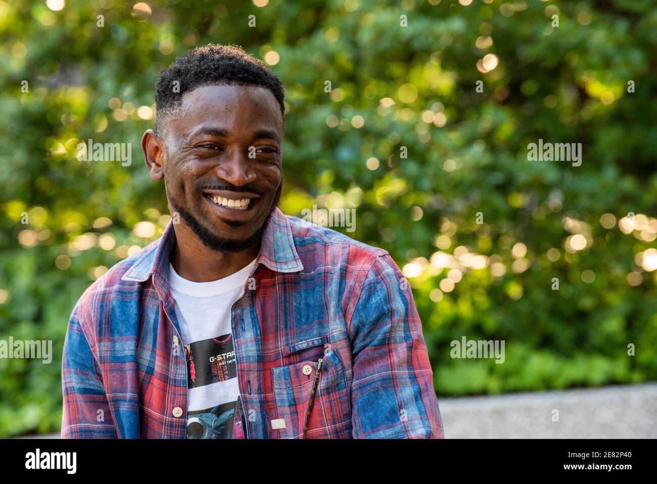 A happy Black man in an outdoor setting Stock Photo - Alamy