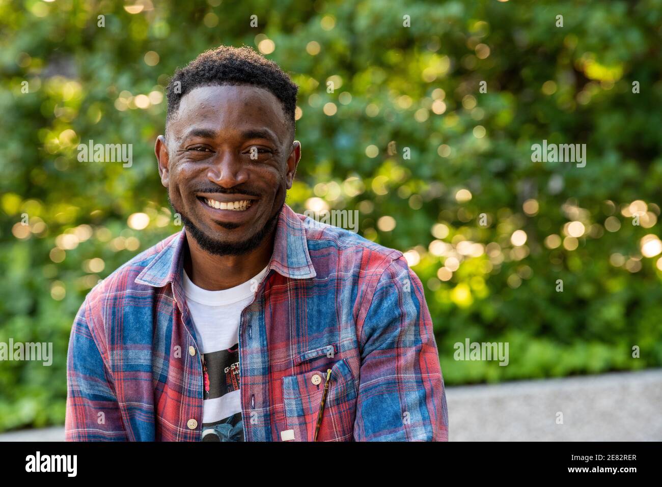 A happy Black man in an outdoor setting Stock Photo - Alamy