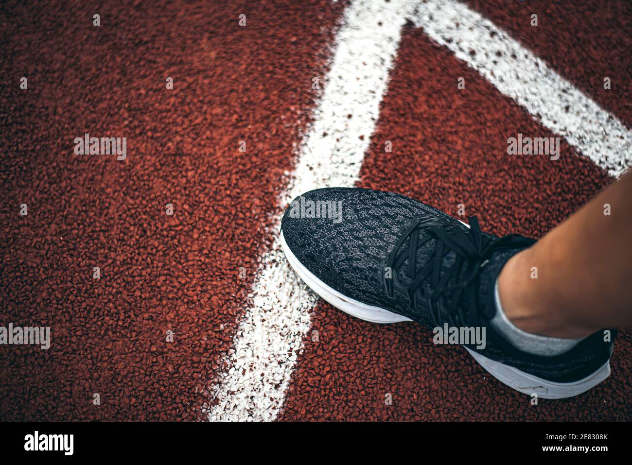 legs of athletes wearing sports shoes on running track Stock Photo - Alamy