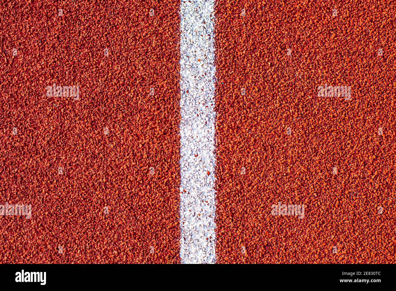 Red Running track in stadium Stock Photo - Alamy