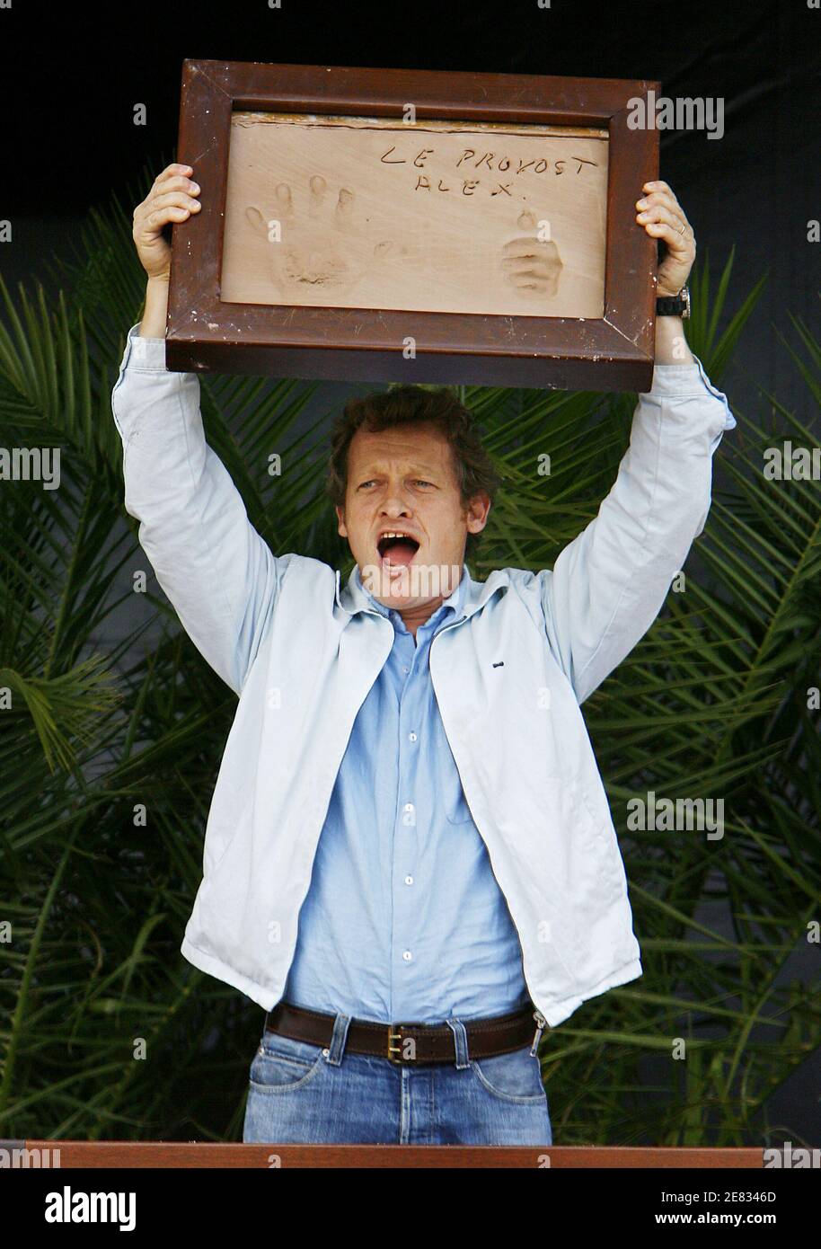 Alexandre Le Provost poses with his handprints in the clay during the ...