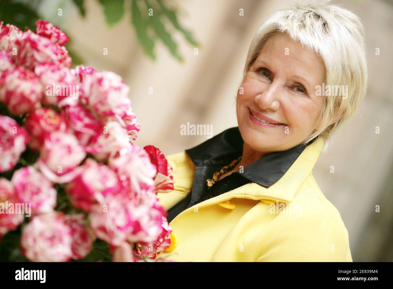 Daniele Gilbert poses with a bunch of roses during a presentation to ...