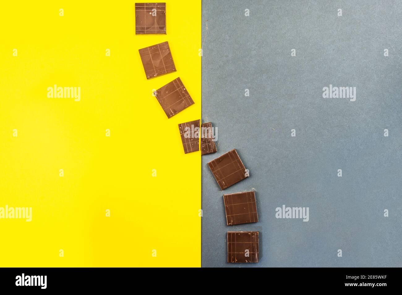 chocolate bars create geometric shapes on a yellow and gray background ...
