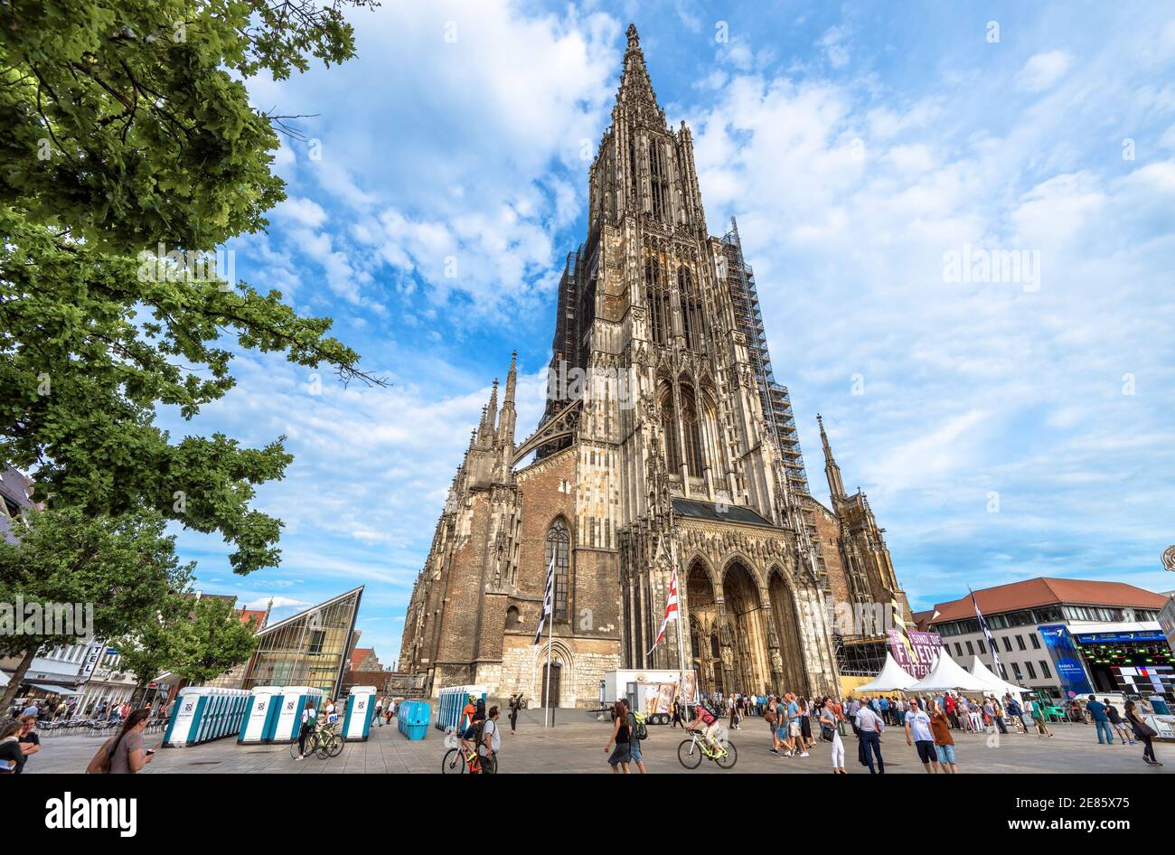 Ulm, Germany – July 20, 2019: People walk next to Ulm Minster or ...