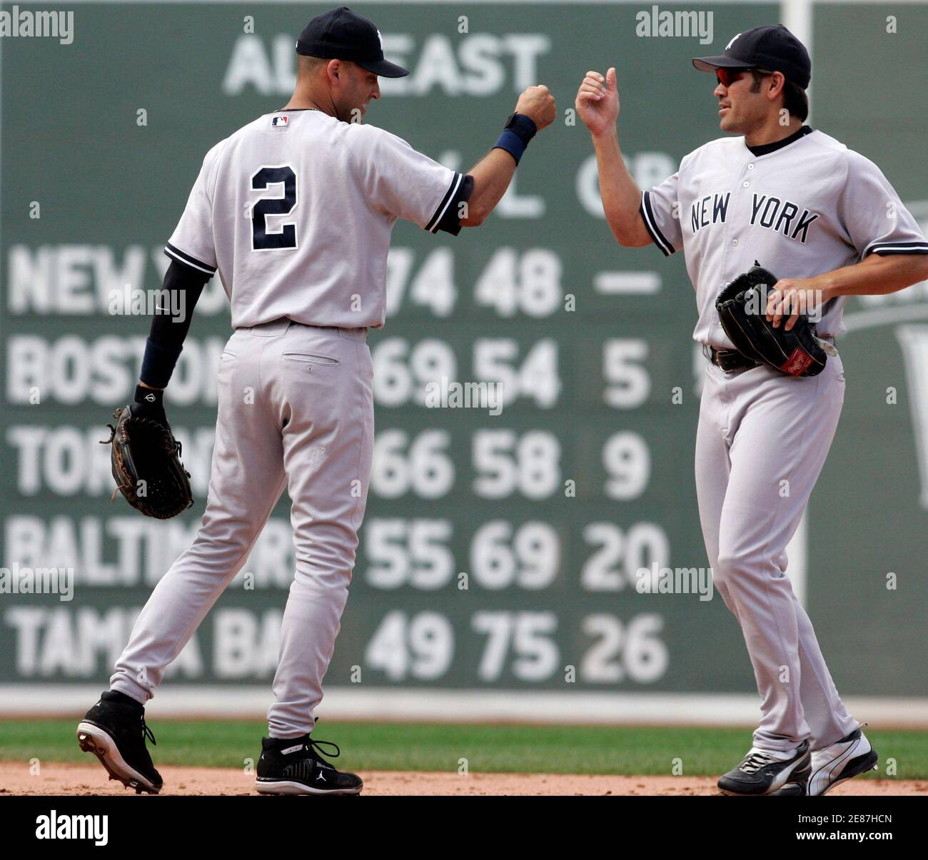New York Yankees' Derek Jeter (L) and Johnny Damon celebrate their ...