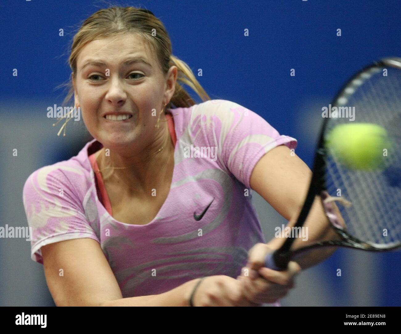 Maria Sharapova of Russia returns a ball to Patty Schnyder of ...