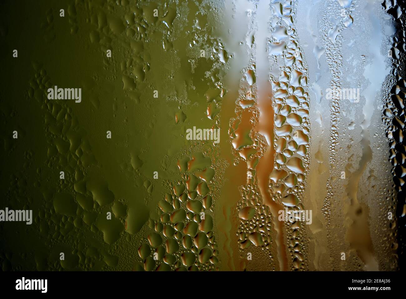 Condensation with beaded moisture droplets on the outside of a cold ...