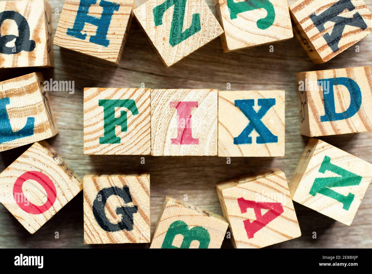 Alphabet letter block in word fix with another on wood background Stock ...