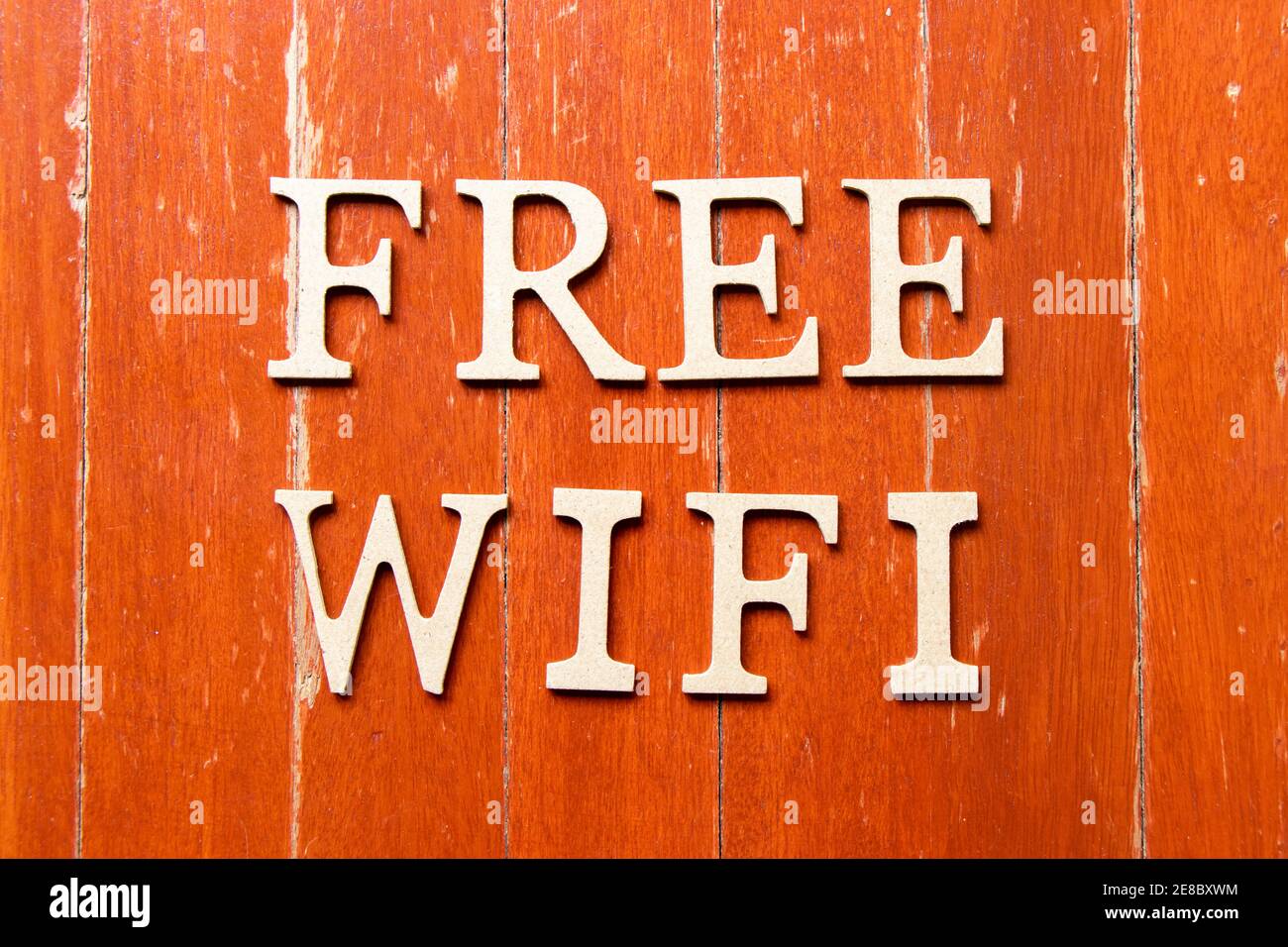 Alphabet letter in word free wifi on old red color wood plate ...