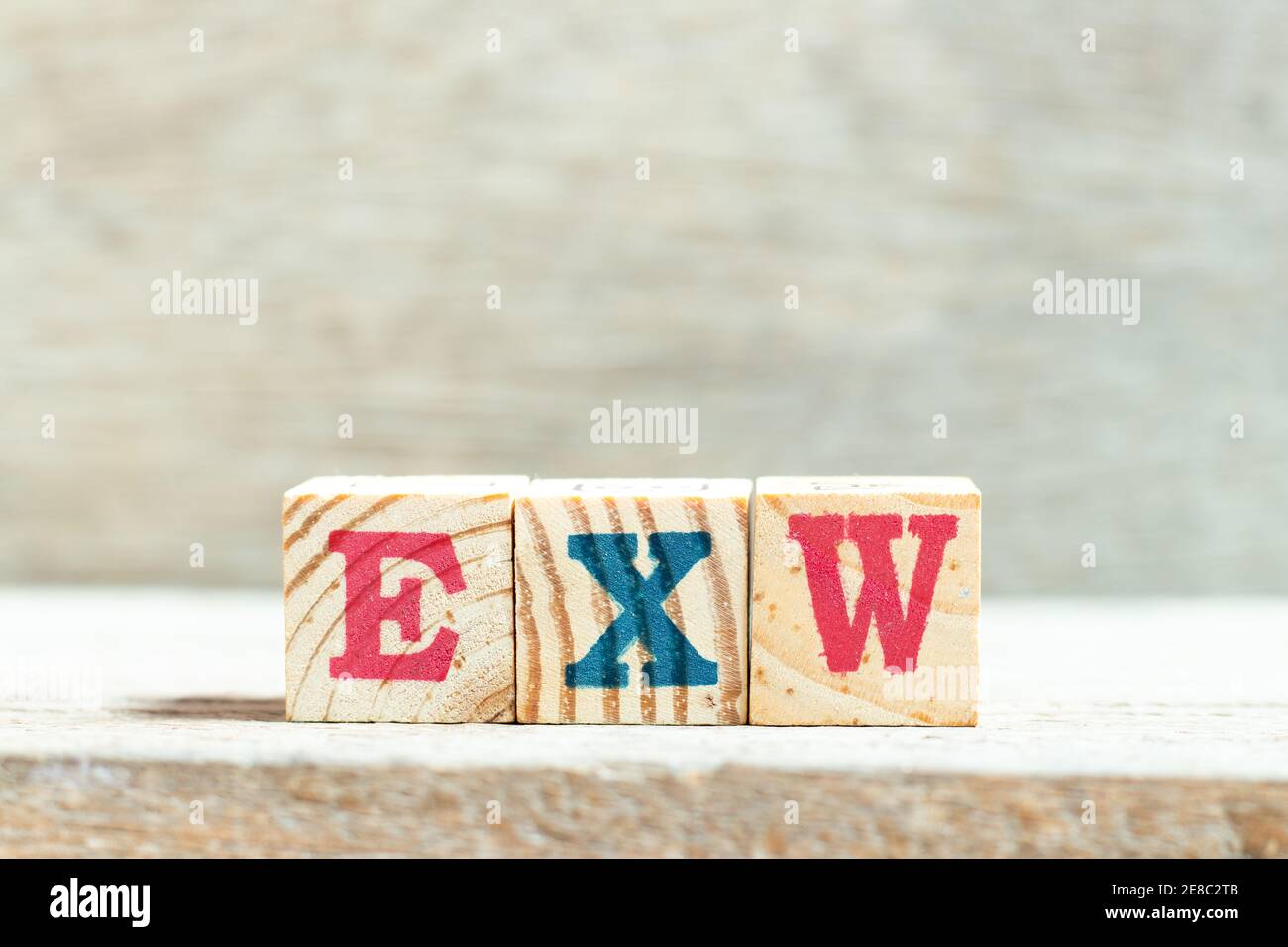 Alphabet letter block in word EXW (abbreviation of Ex works) on wood ...