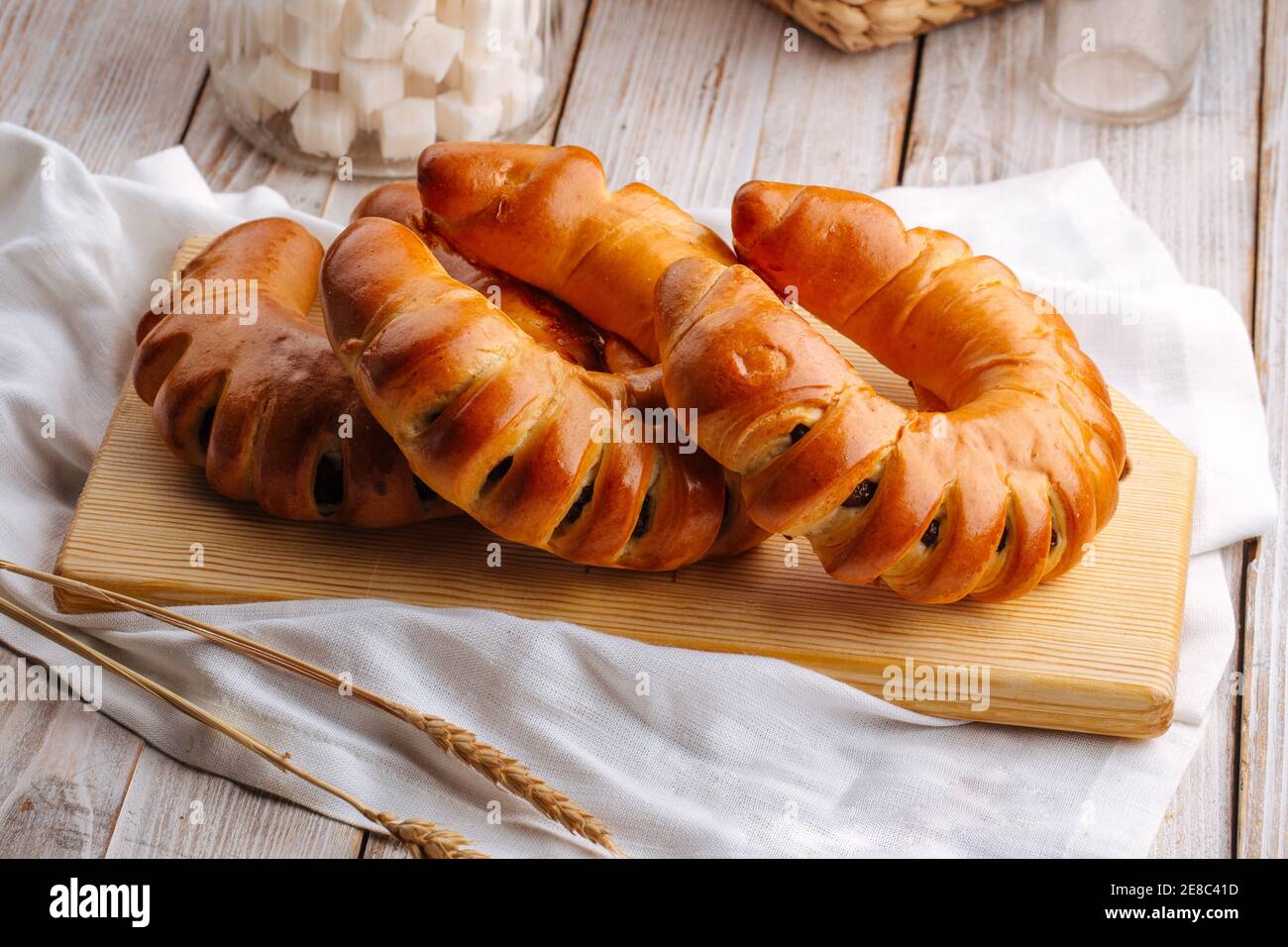 Side view on three fresh baked bagel buns Stock Photo - Alamy