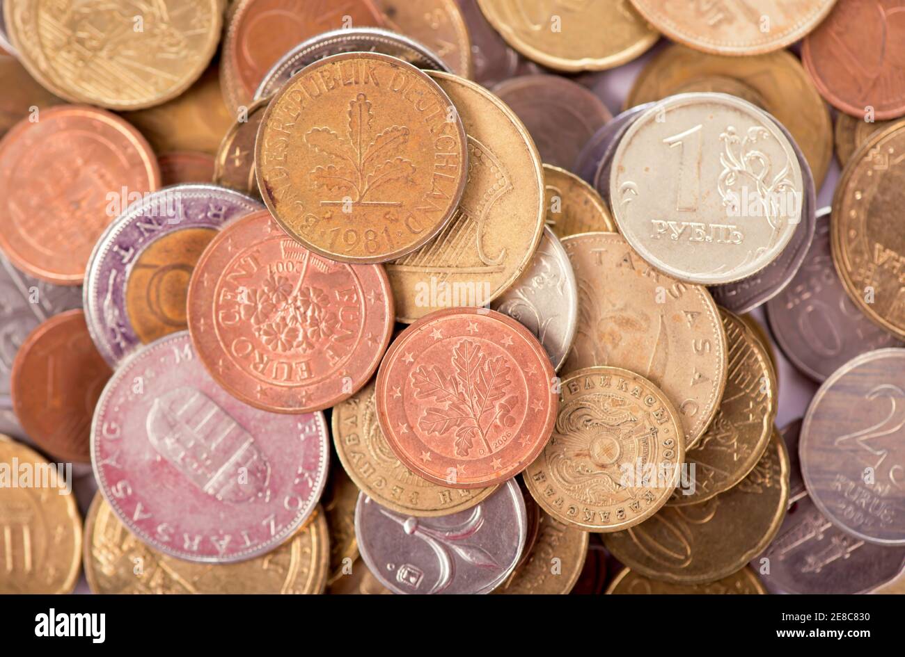 Coins of different countries on a white background Stock Photo - Alamy