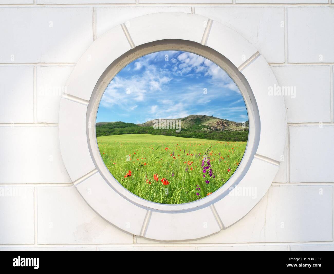 Old white antique round window on wall from stones. Element of design ...