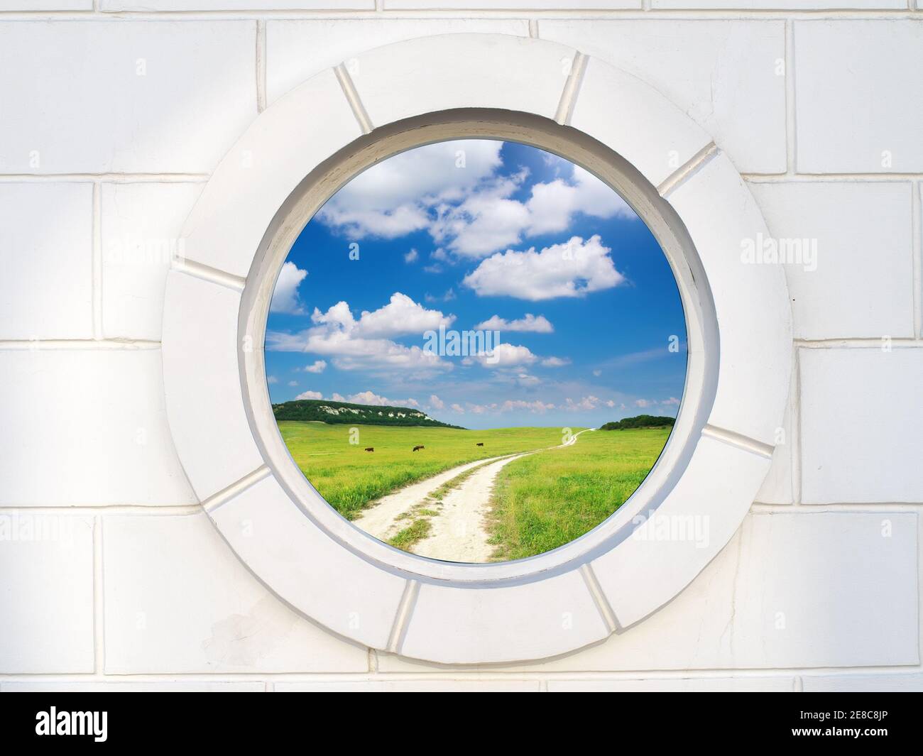 Old white antique round window on wall from stones. Element of design ...