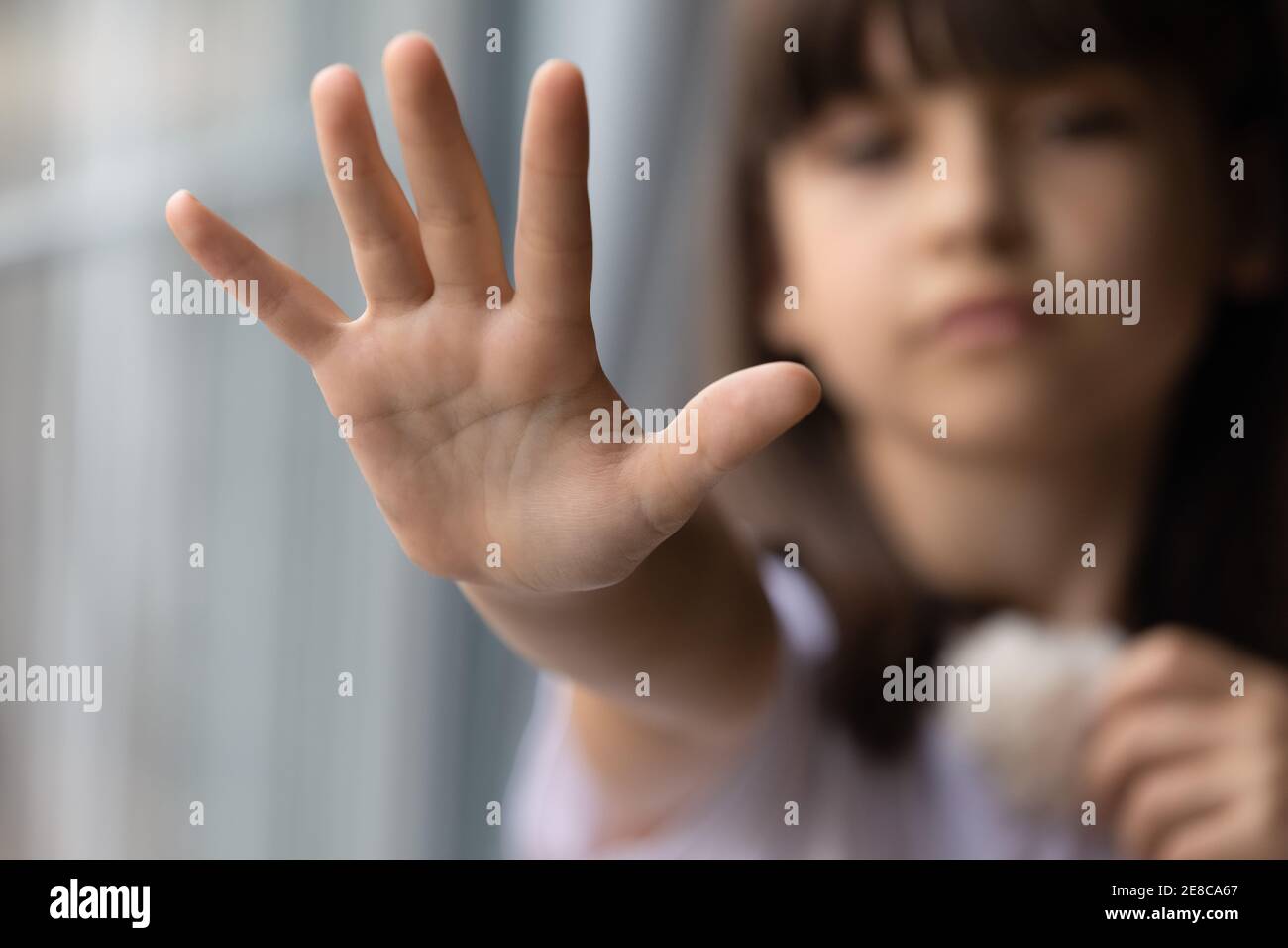 Close up lonely little girl offering hand, asking help Stock Photo - Alamy