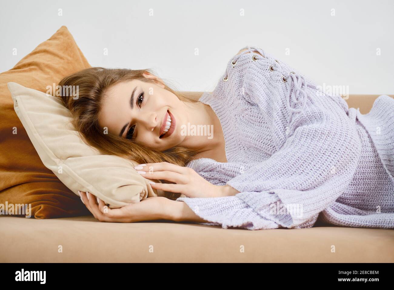 Laying on sofa hi-res stock photography and images - Alamy